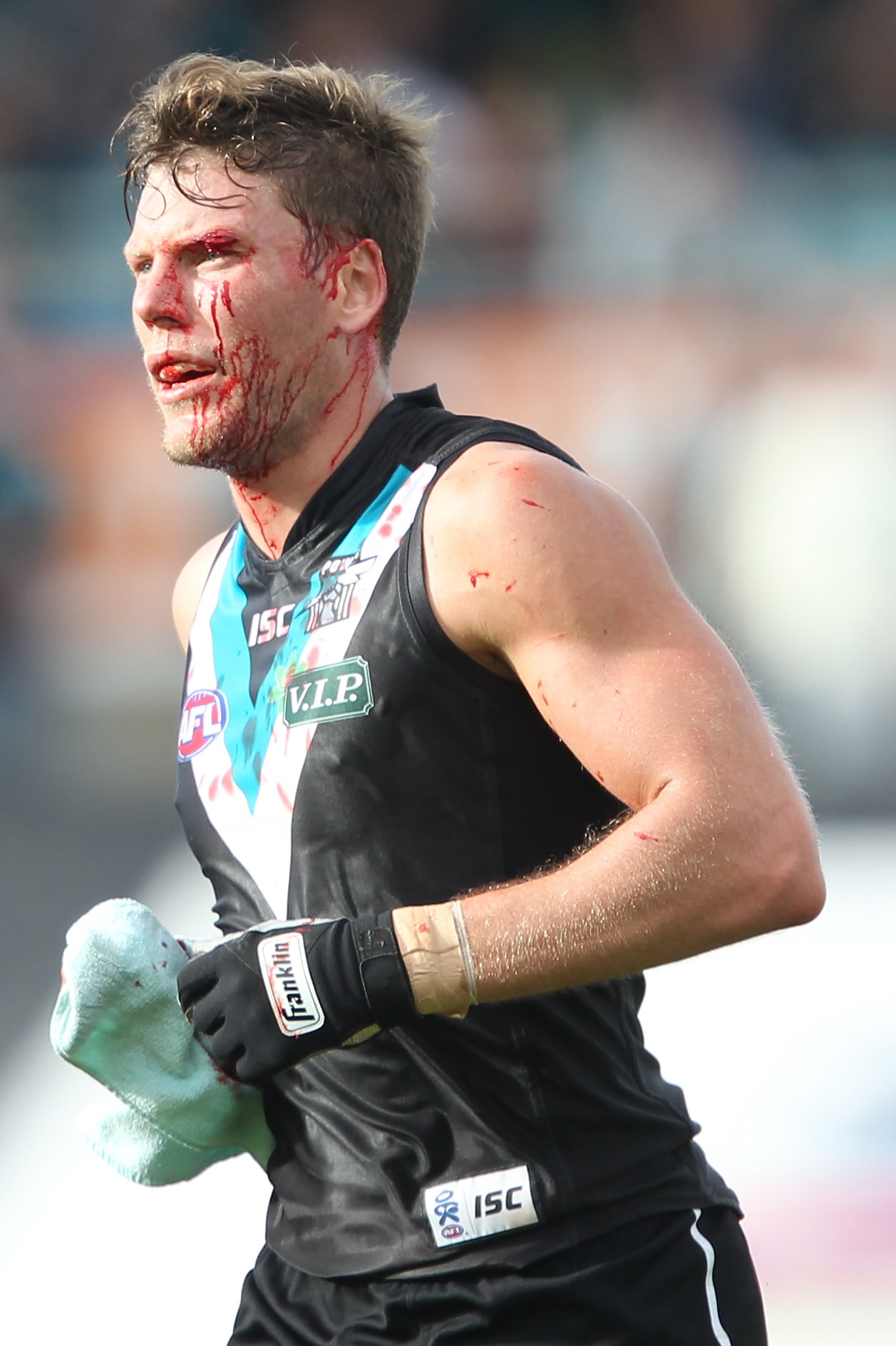Young Port Adelaide supporter channels inner warrior on Halloween